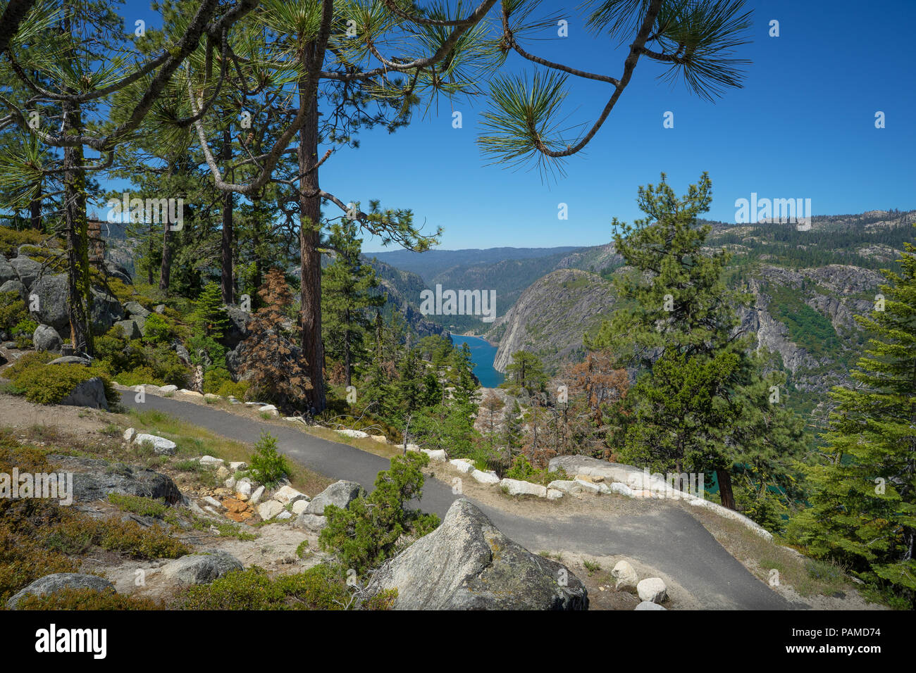 View of Donnell Lake and Dam through forest trees - Highway 108 ...
