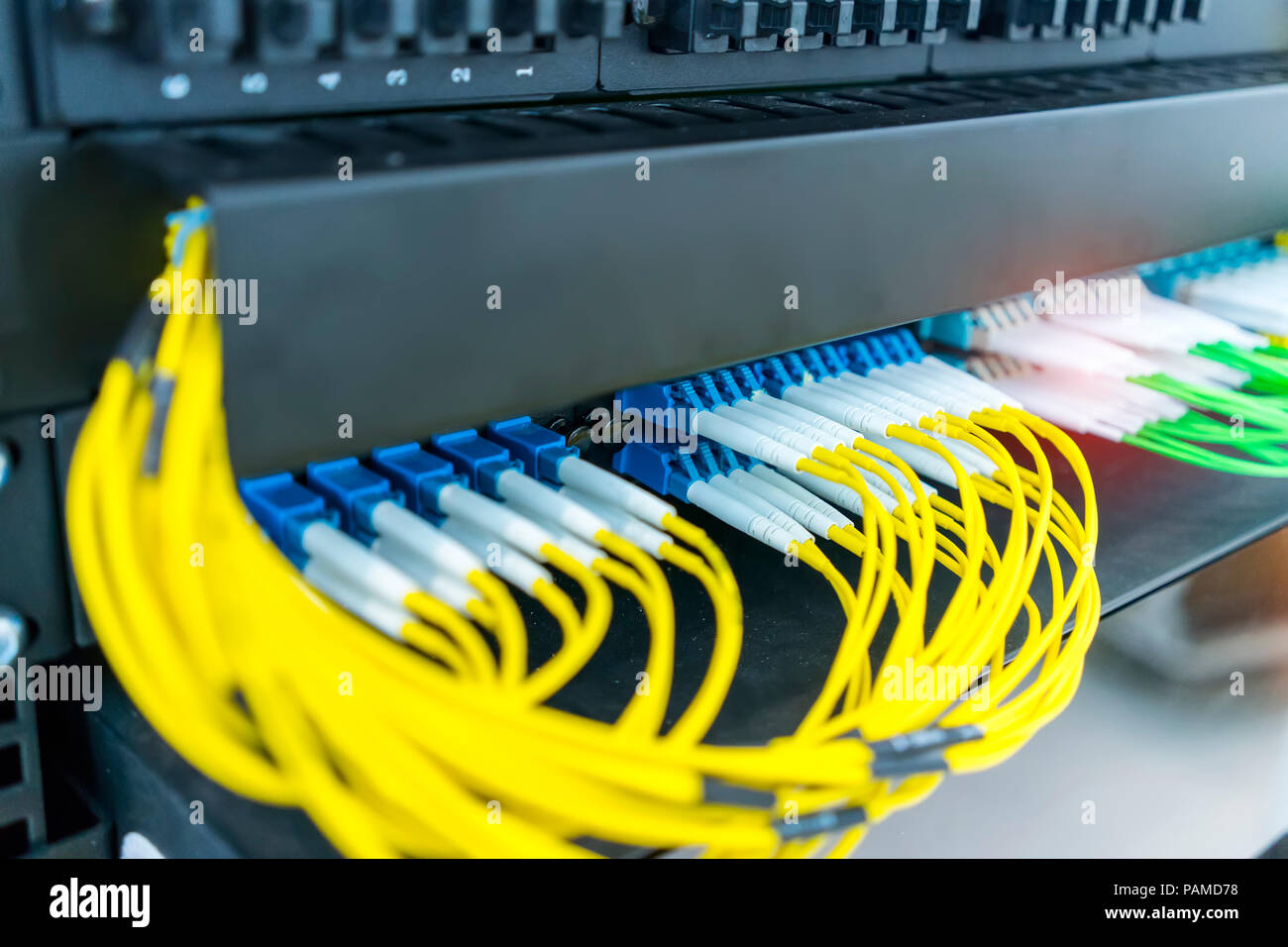fiber optic telecommunication equipment and patchcords inside a network ...