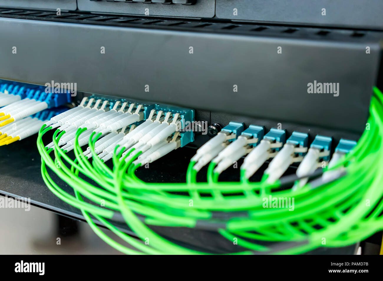 fiber optic telecommunication equipment and patchcords inside a network ...