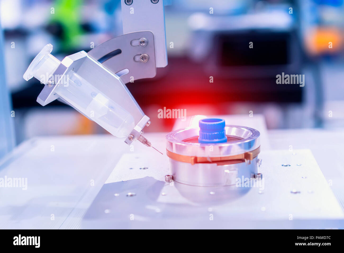 Robot holding glue syringe Injection Stock Photo - Alamy