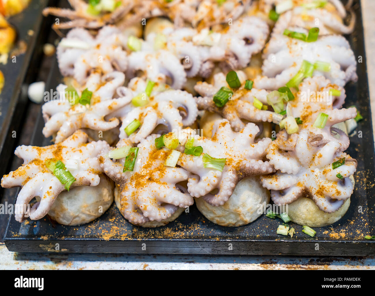 Octopus cooked on grill barbecue hi-res stock photography and images ...