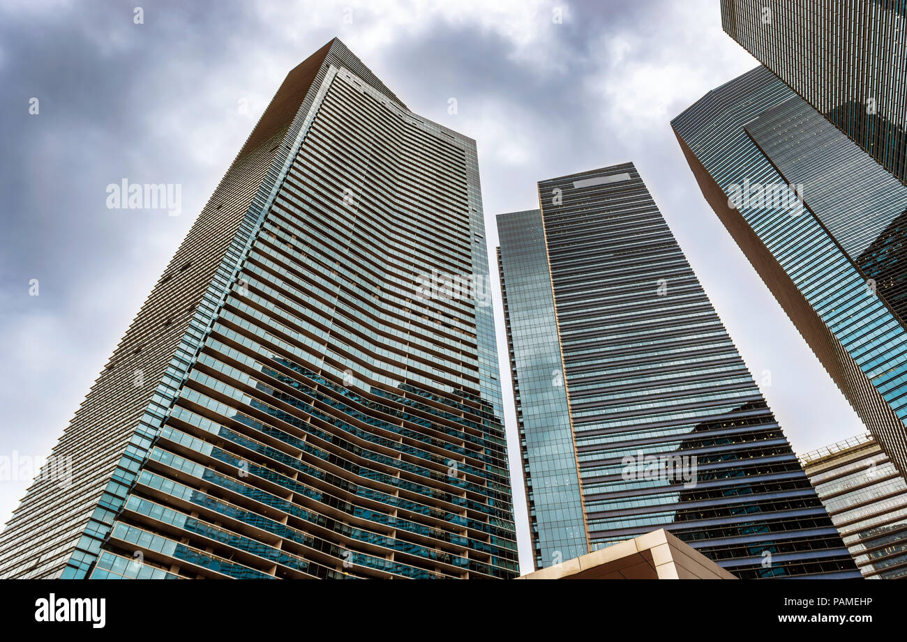 View from the street level at the glass, steel and concrete structures ...