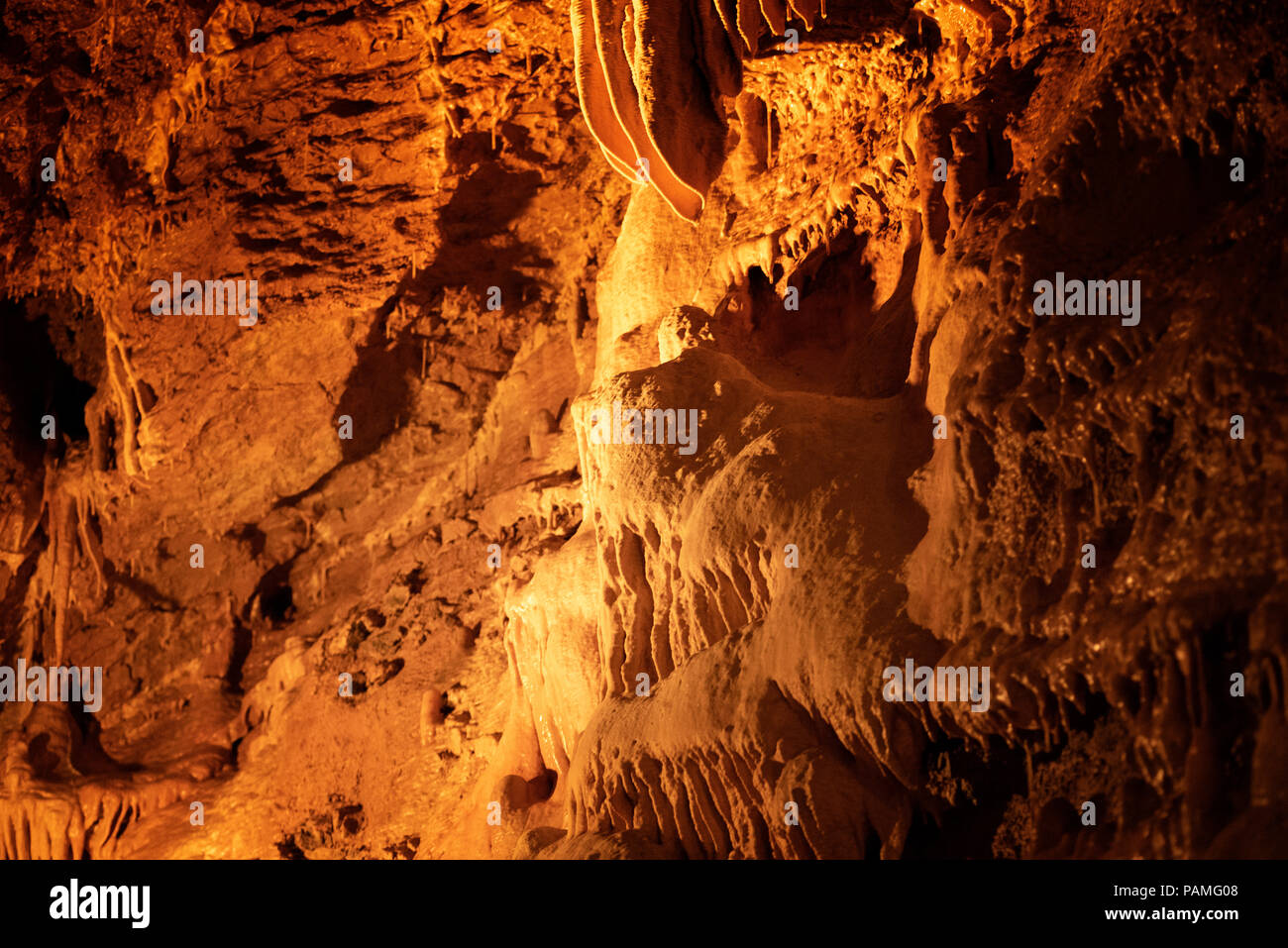 stalagmite with color light in the cave Stock Photo - Alamy