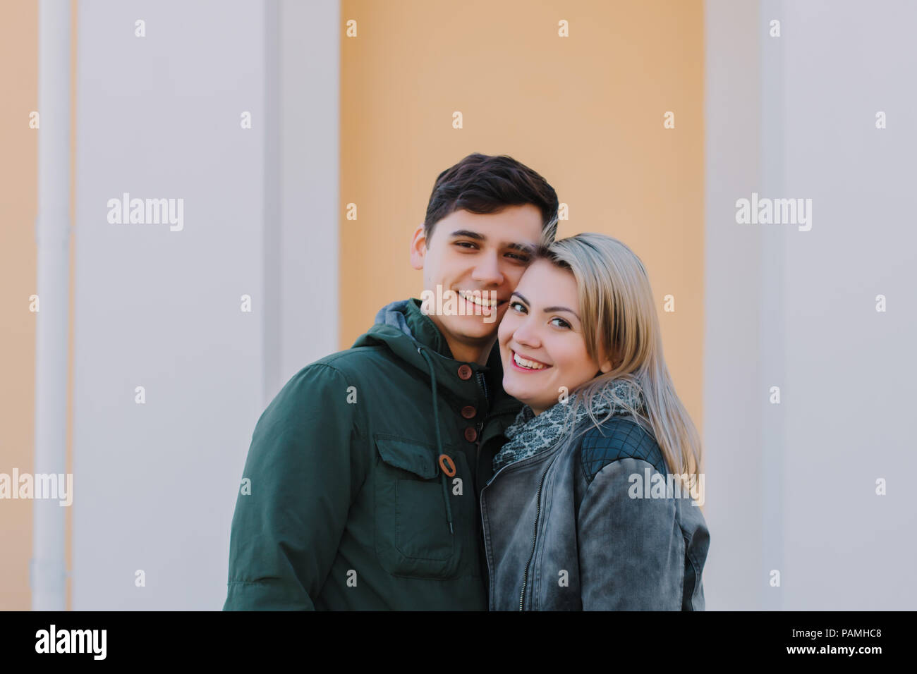 Beautiful loving each other couple smiling and kissing Stock Photo - Alamy
