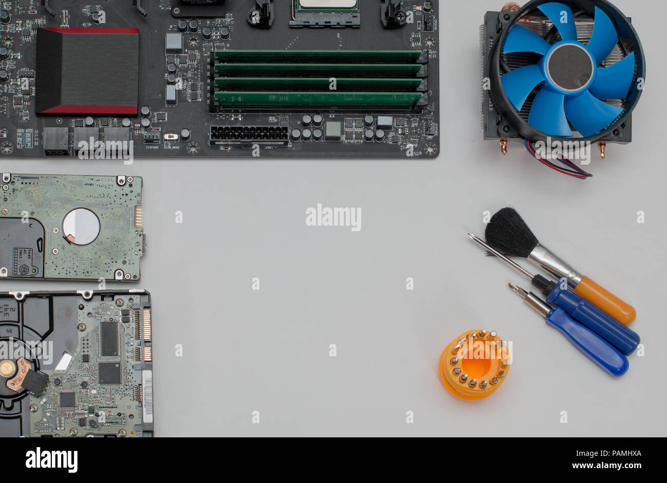 Computer assembly details and tools on a white background Stock Photo ...