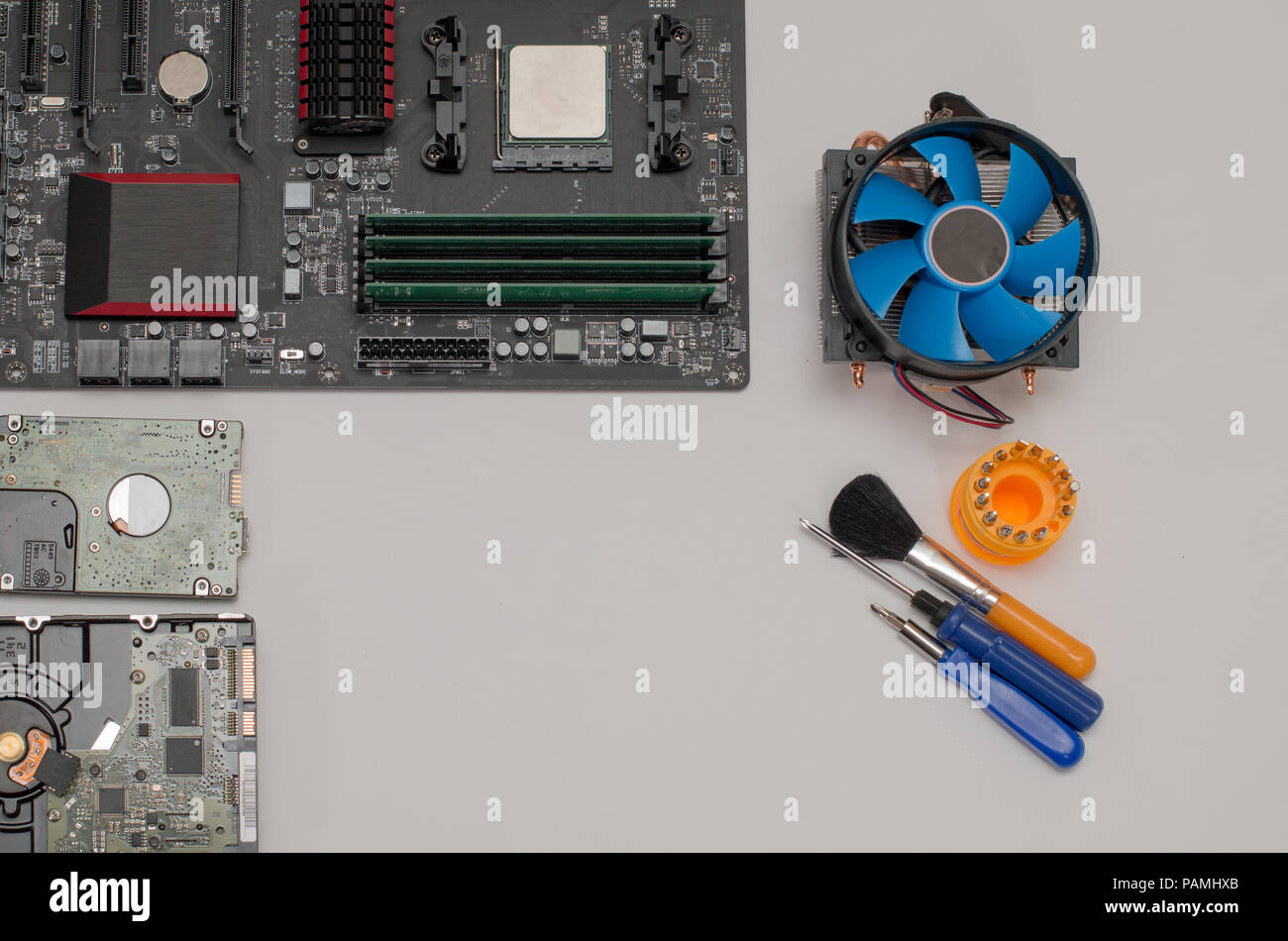 Computer assembly details and tools on a white background Stock Photo ...