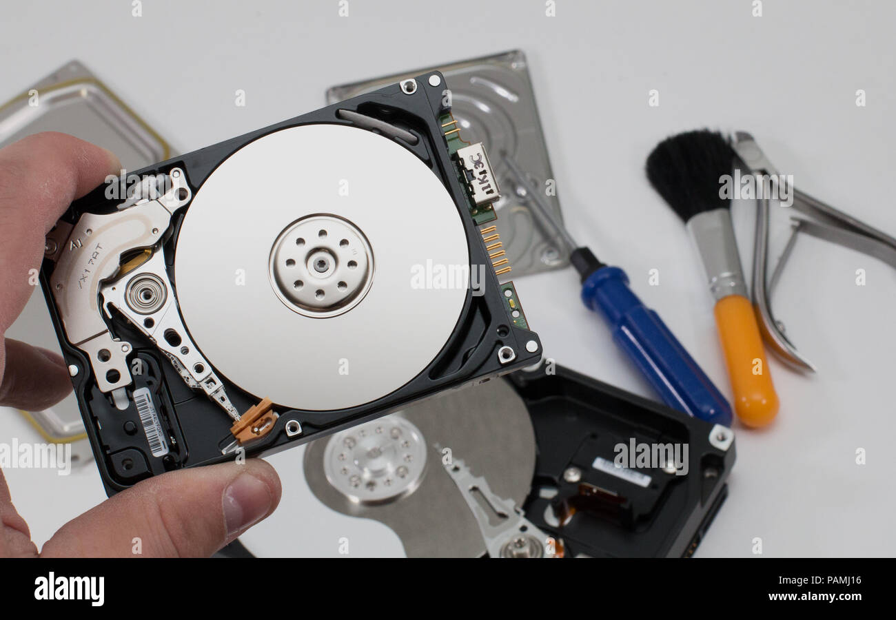 Process of disassembly of hard disks Stock Photo - Alamy