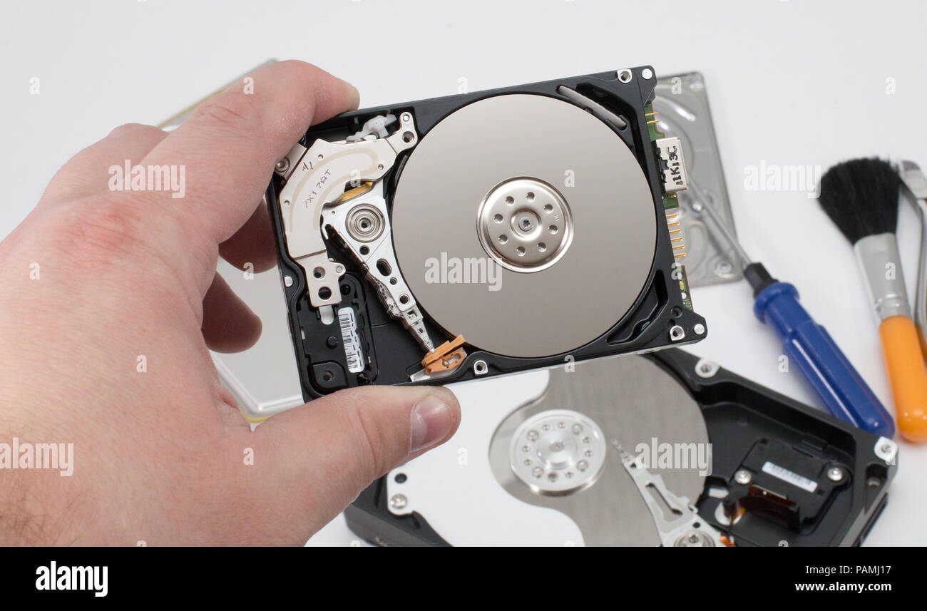 Process of disassembly of hard disks Stock Photo - Alamy