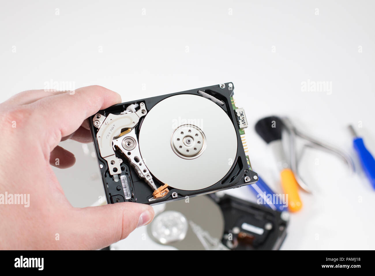 Process of disassembly of hard disks Stock Photo - Alamy