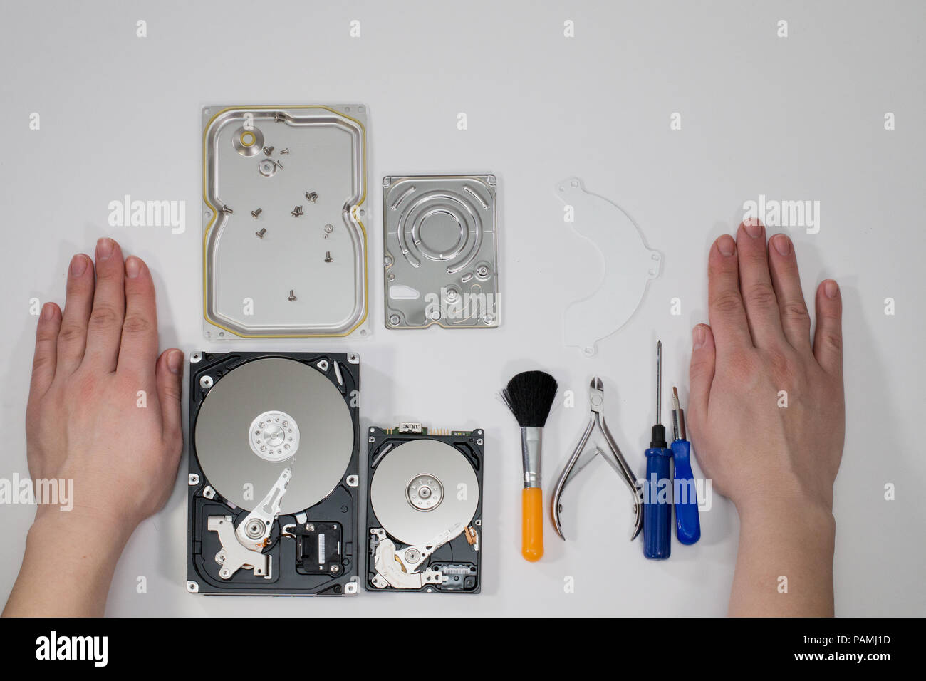 Process of disassembly of hard disks Stock Photo - Alamy