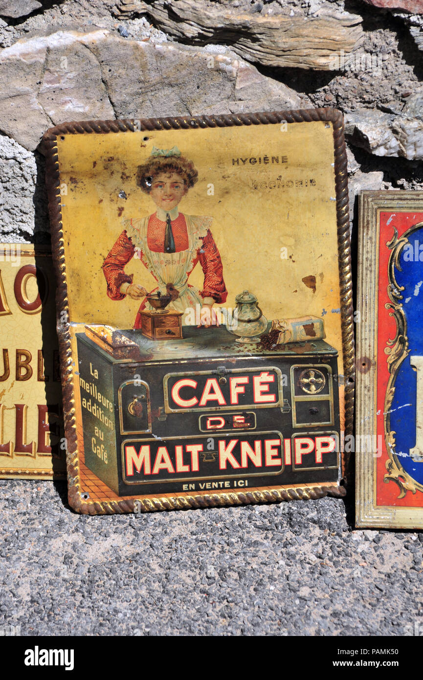 French metal advertising sign in french market Stock Photo - Alamy