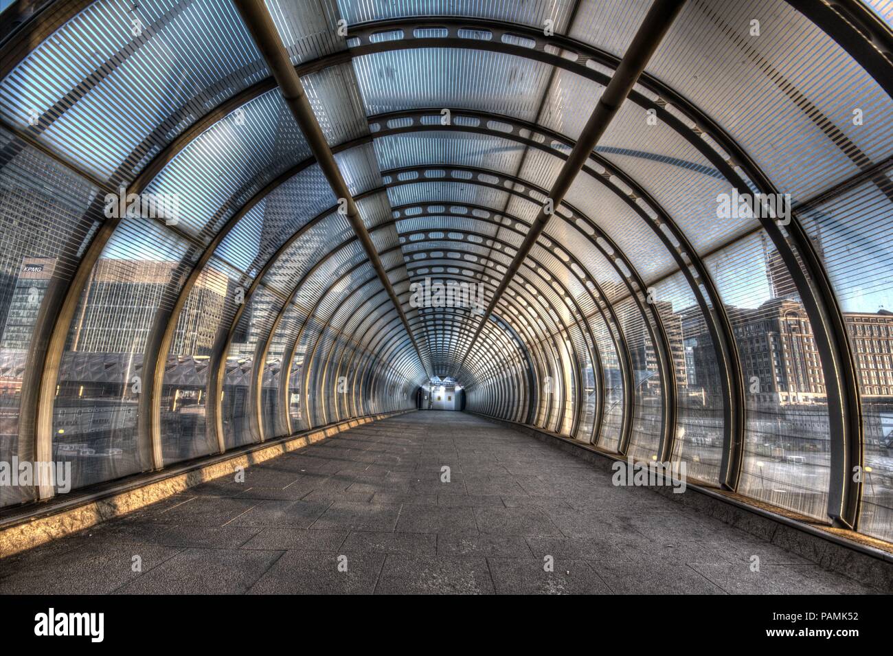 Steel frame and glass roofed Bridge walkway in dockland, Canary Wharf ...