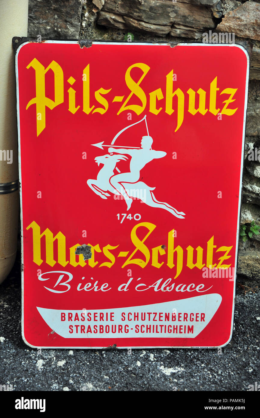 French metal advertising sign in french market Stock Photo - Alamy