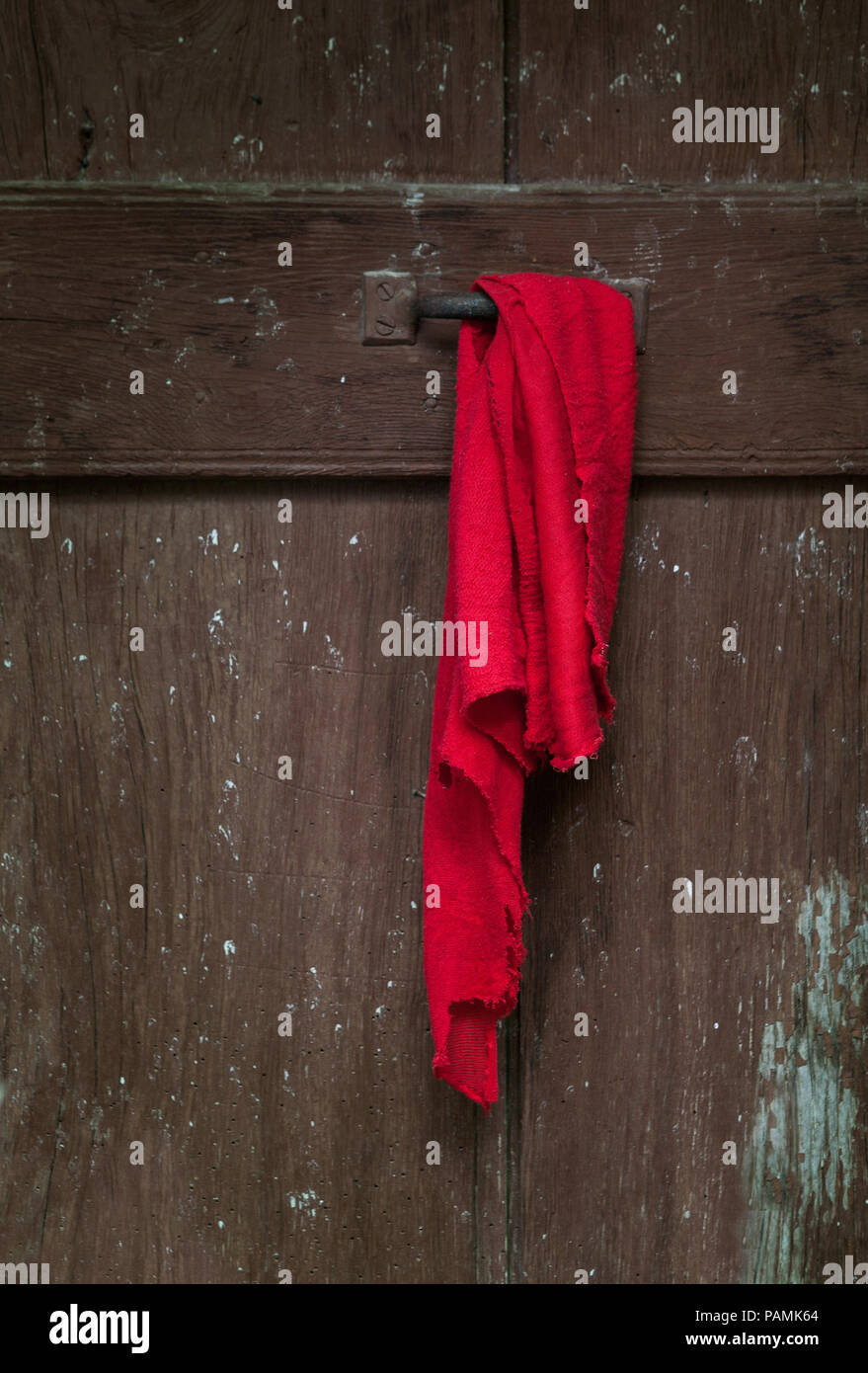 red rag hanging on a door Stock Photo - Alamy