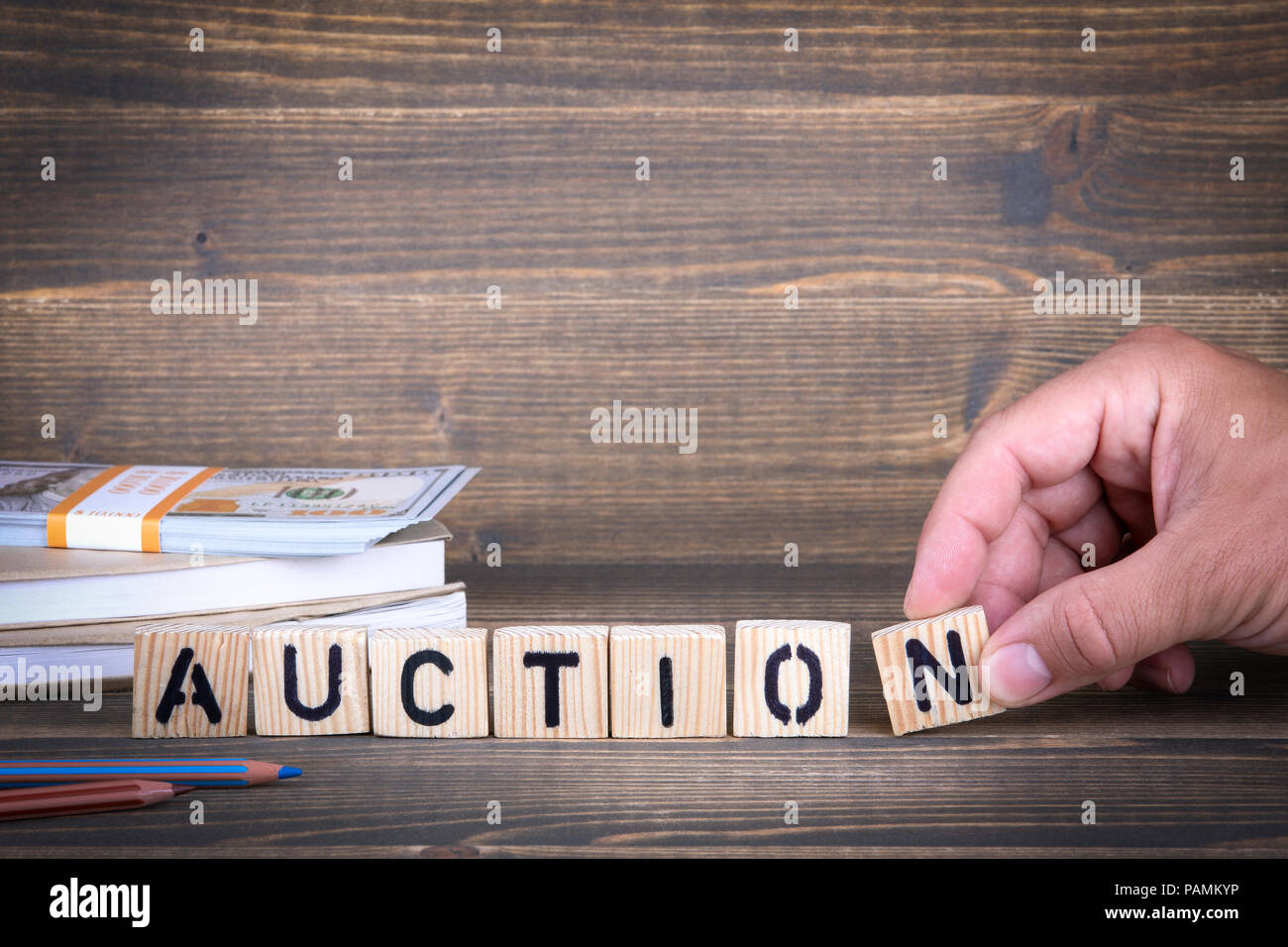 Auction concept. Wooden letters on the office desk Stock Photo - Alamy