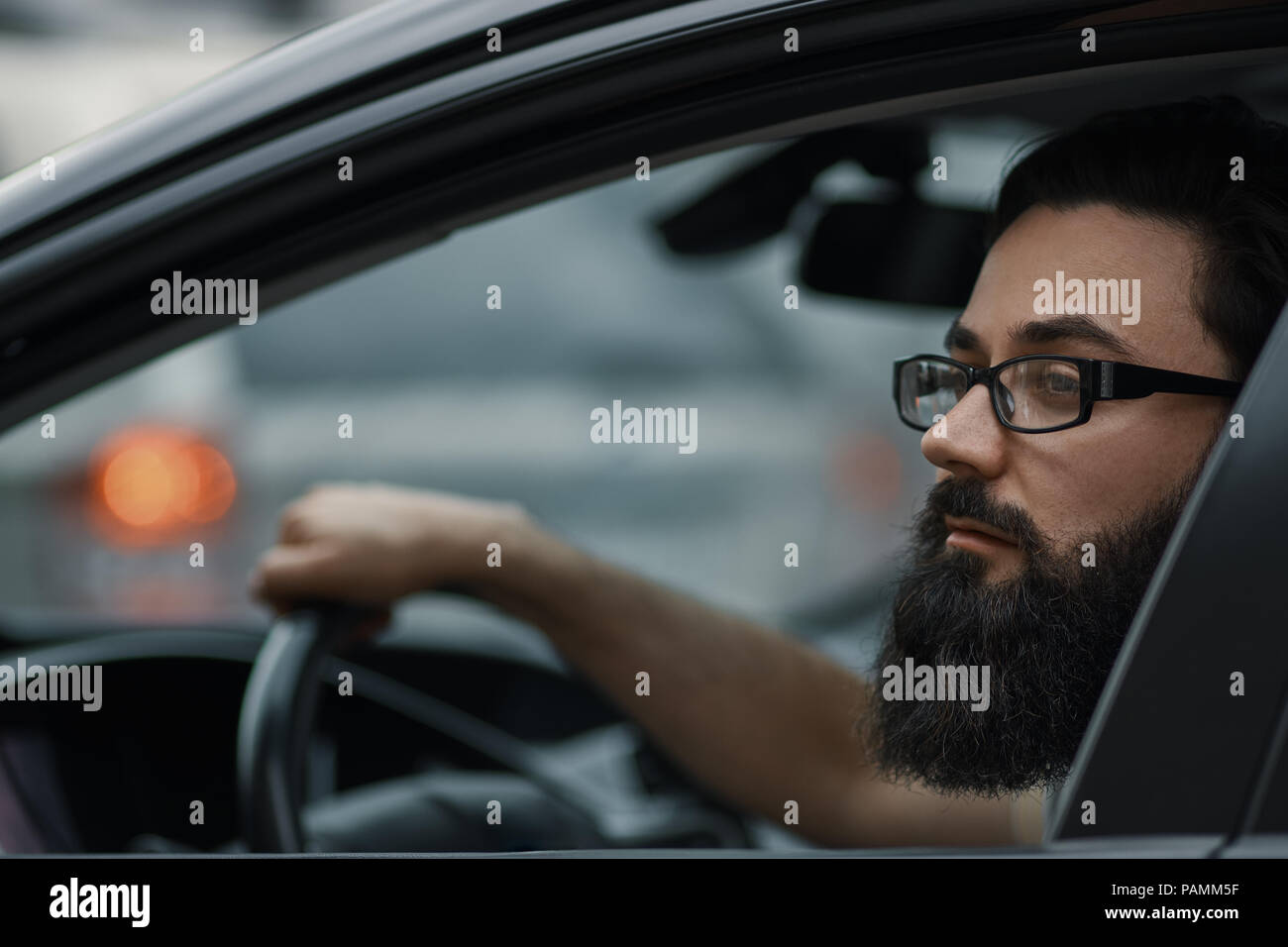 Close up portrait, serious man driving a car Stock Photo - Alamy