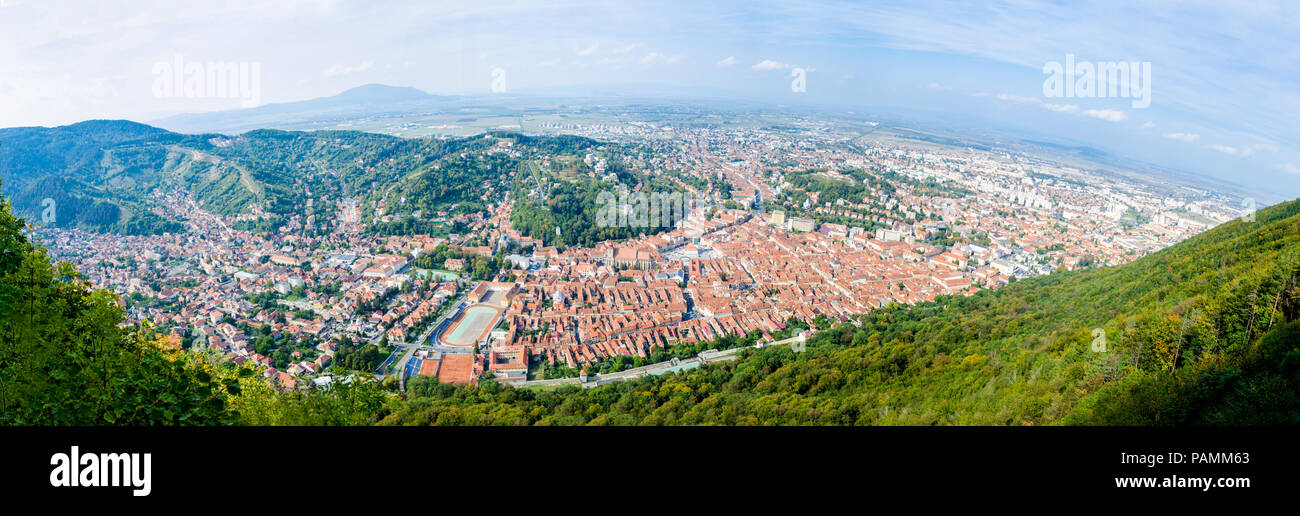 Old city of Brasov in Transylvania region of Romania in a ultra wide ...