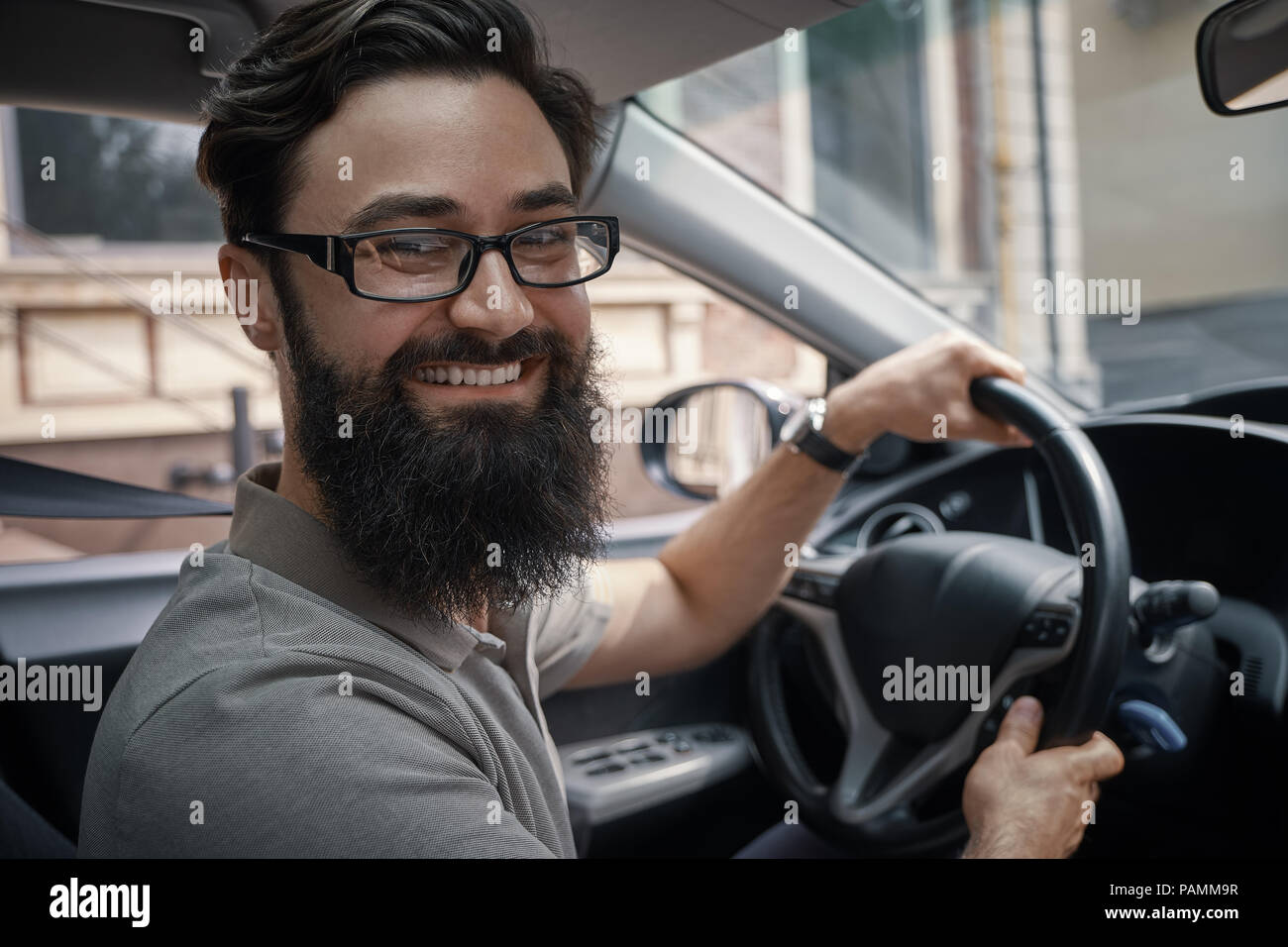 Handsome, happy man driving the car Stock Photo - Alamy