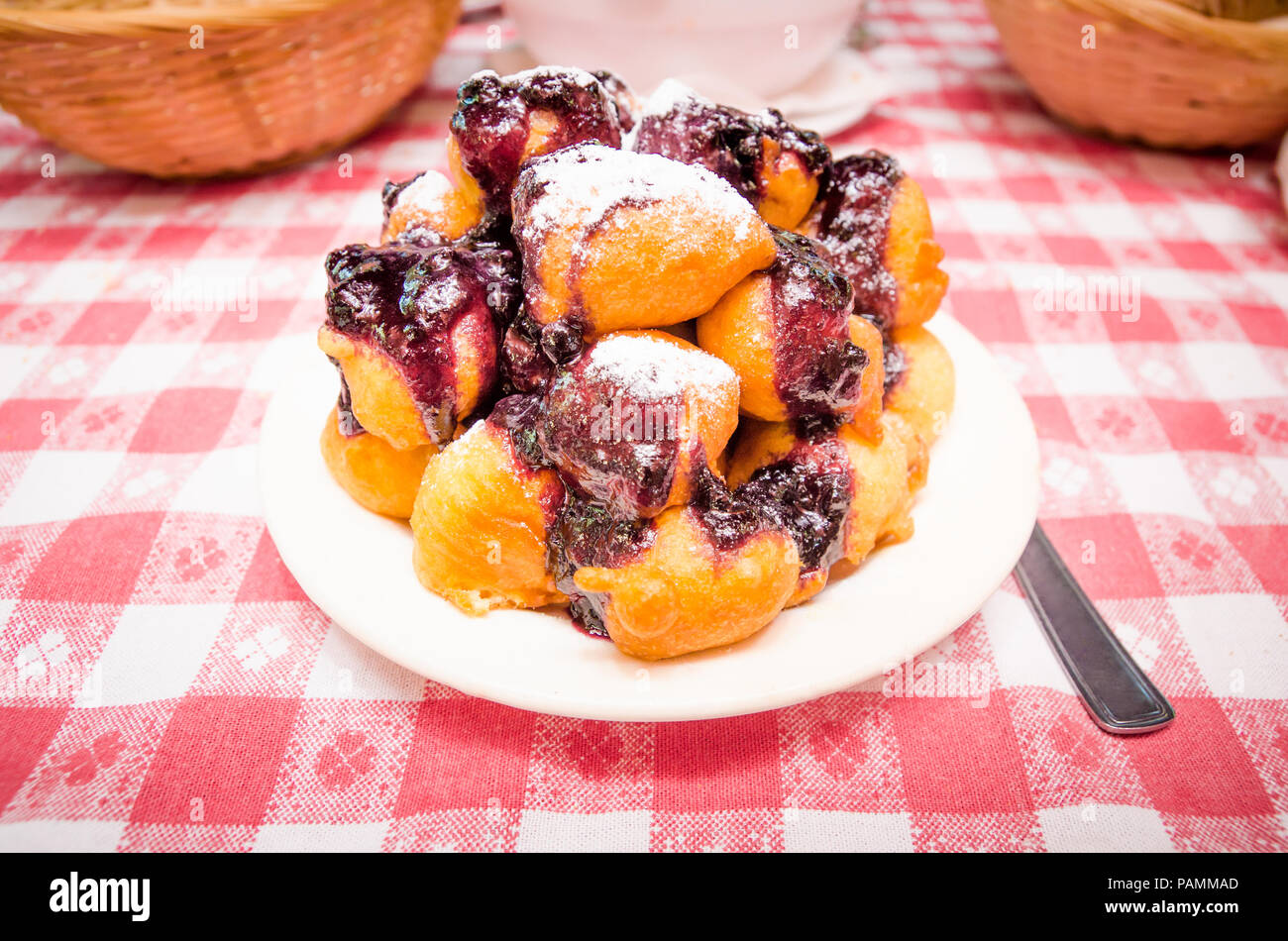 Traditional romanian donuts with blueberry jam on a white plate Stock ...