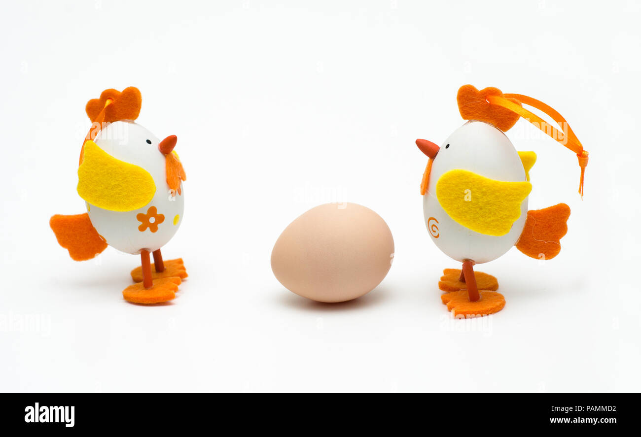Two easter eggs arging over an egg Stock Photo - Alamy