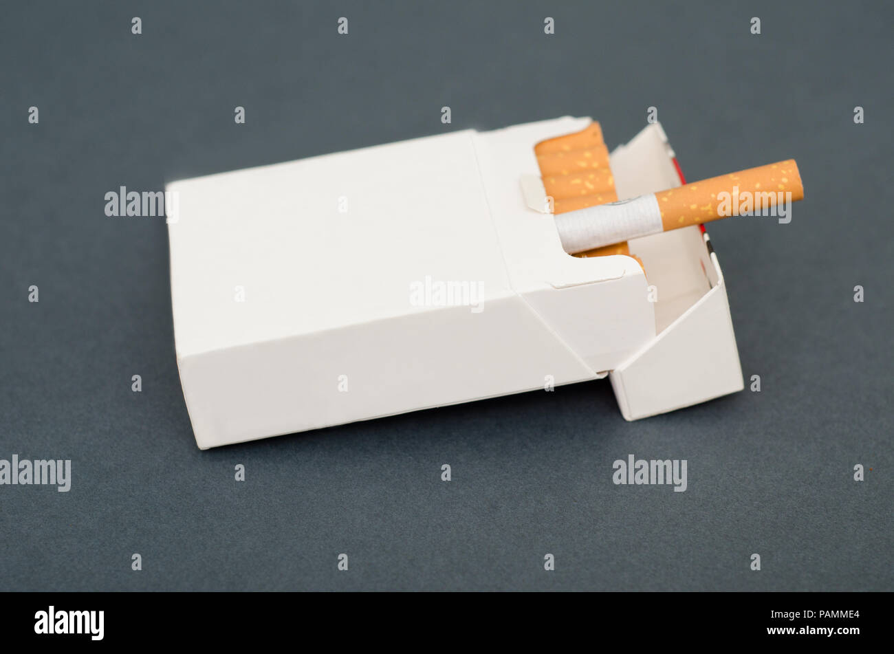 Cigarette pack on a gray background Stock Photo - Alamy