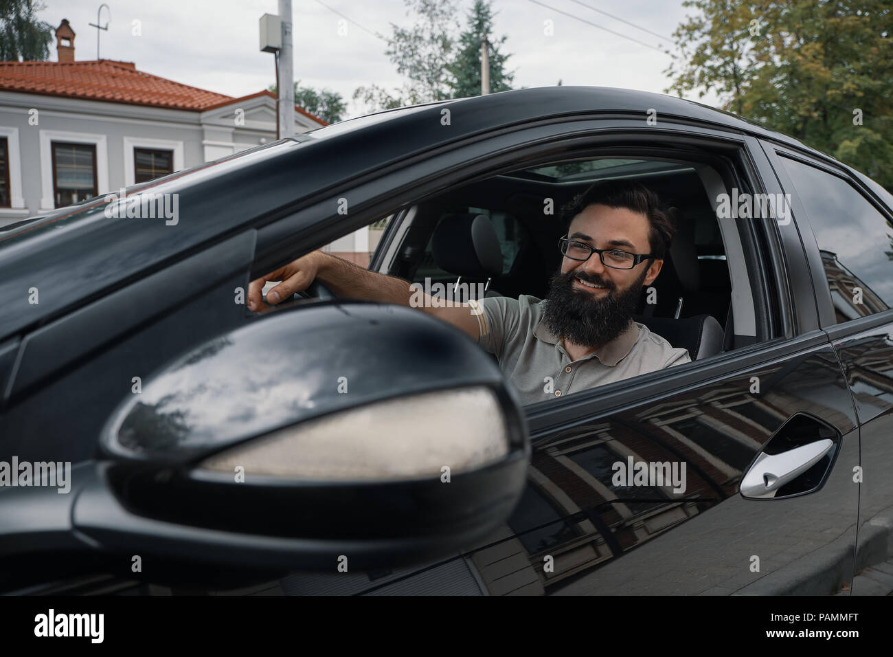 Joyful man driving car hi-res stock photography and images - Alamy