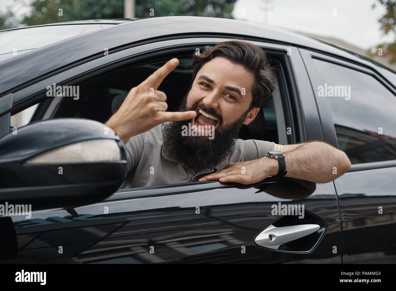 Cheerful man driving car showing hi-res stock photography and images ...