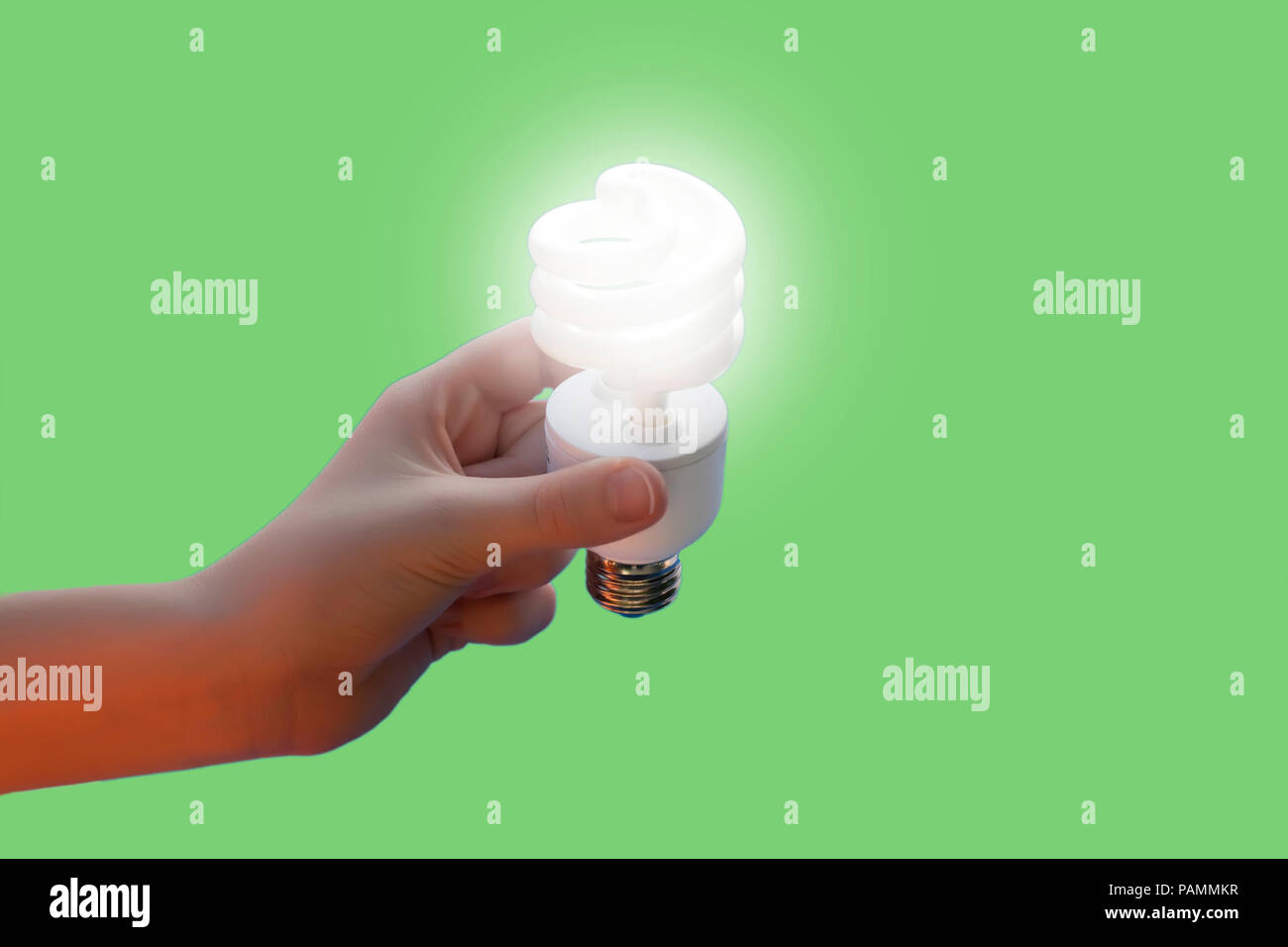 Hand holding energy saving CF light bulb on Stock Photo - Alamy