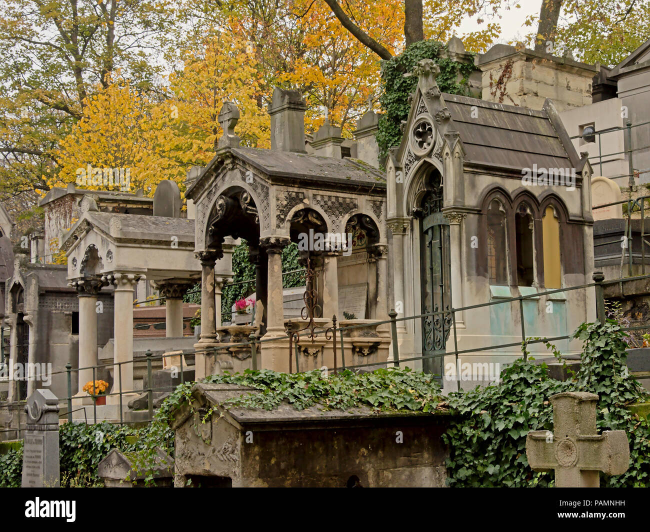 Old grave tombs and autumn trees in Mont martre cemetery, Paris, France ...
