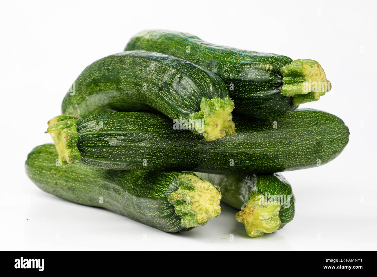 Zucchini on a white table. Tailor measure to measure the waist ...
