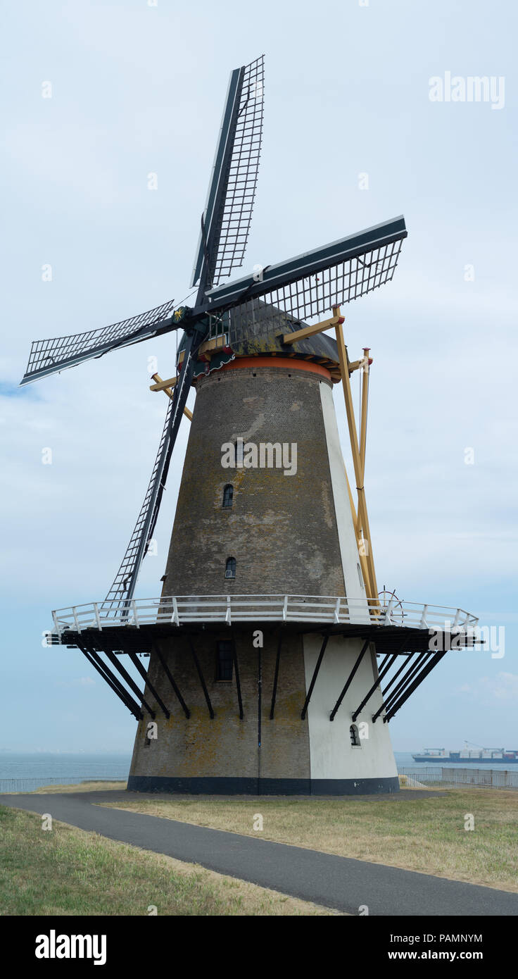Dutch windmill on sea shore, Vlissingen, Zeeland, Netherlands Stock ...
