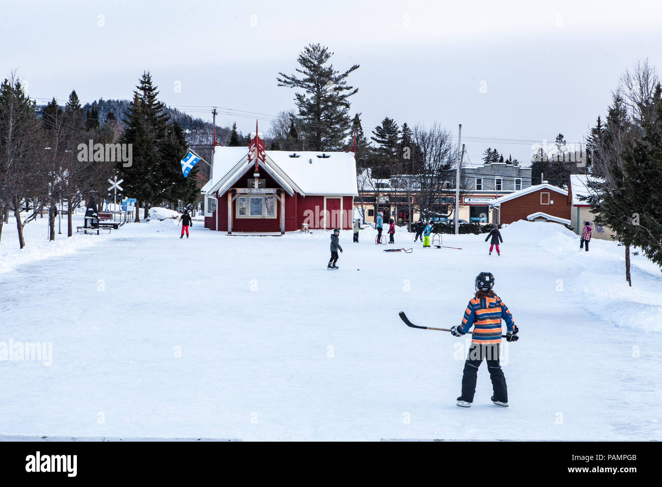 Kids playing ice hockey at the park in Val-David, Quebec, Canada Stock ...