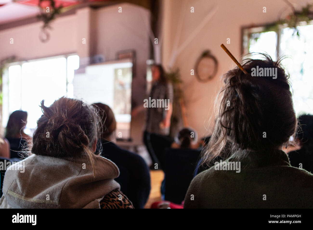 Women only audience pictured from behind during a conference Stock ...