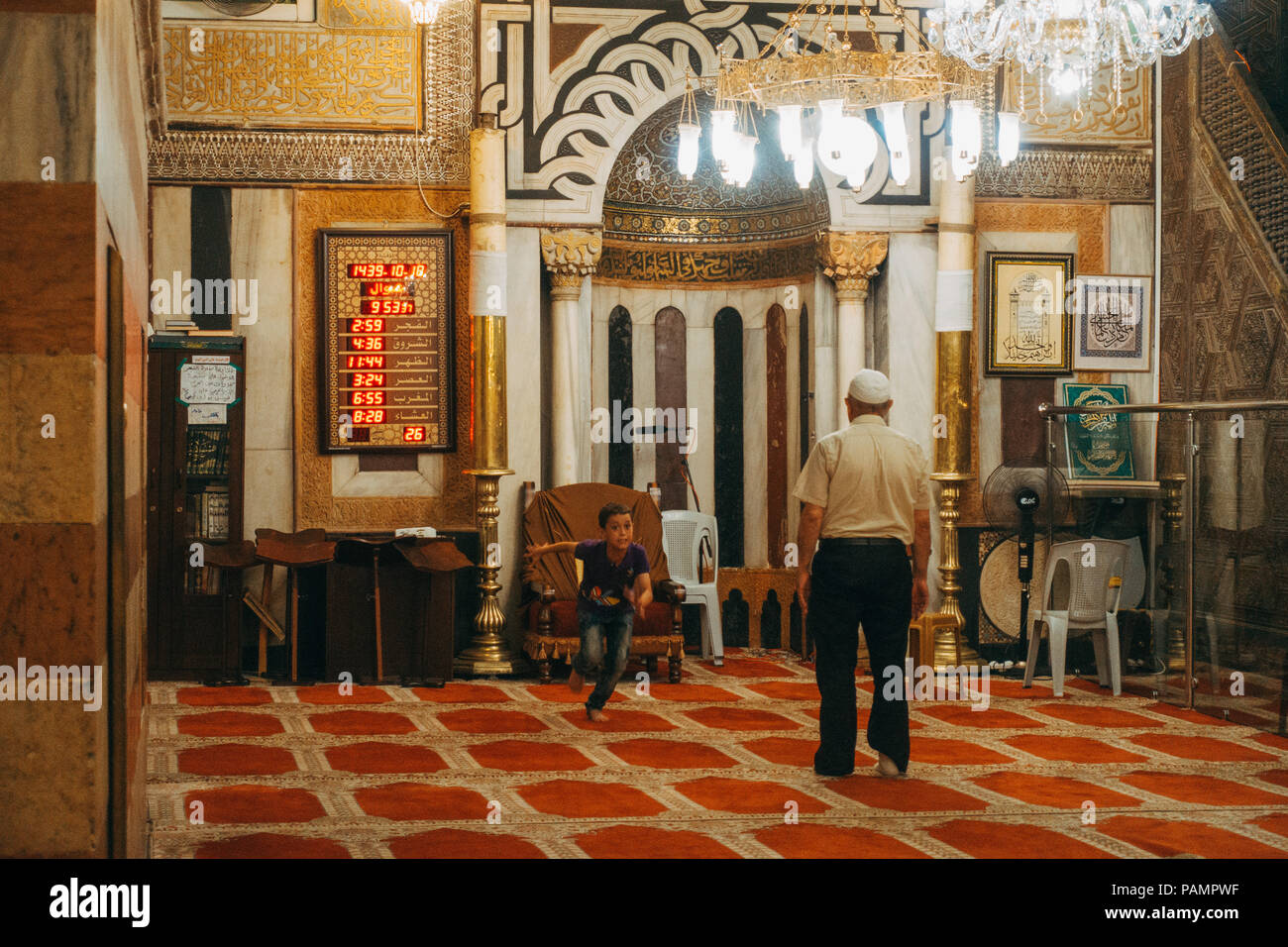 A young boy and an old man inside the Muslim side of the Ibrahimi ...