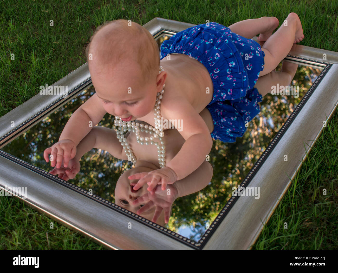 Baby in a Mirror Stock Photo - Alamy