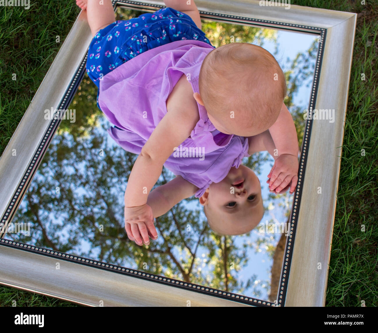 Baby in a Mirror Stock Photo - Alamy