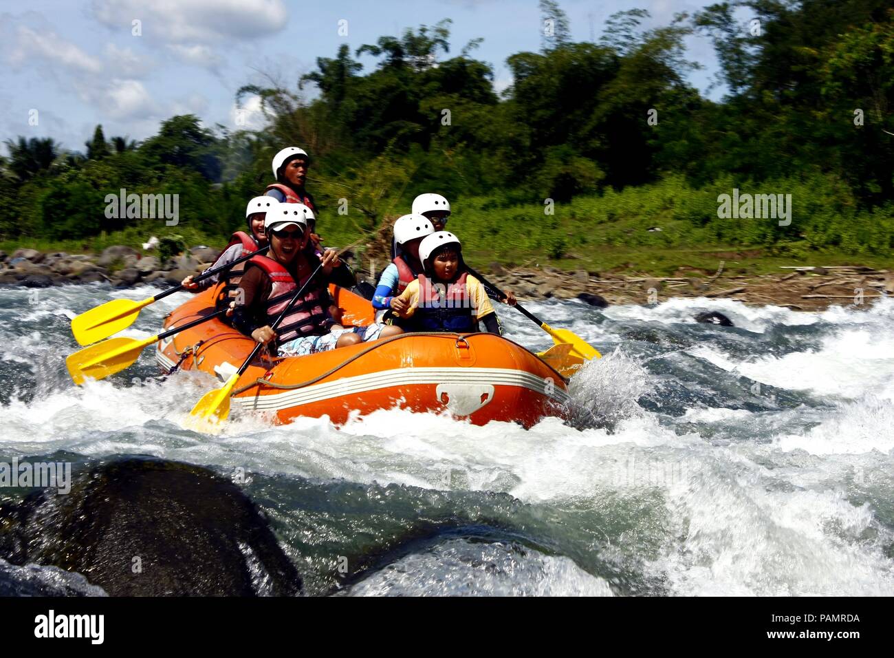 CAGAYAN DE ORO, MINDANAO, PHILIPPINES - JUNE 5, 2009: Tourists ride on ...