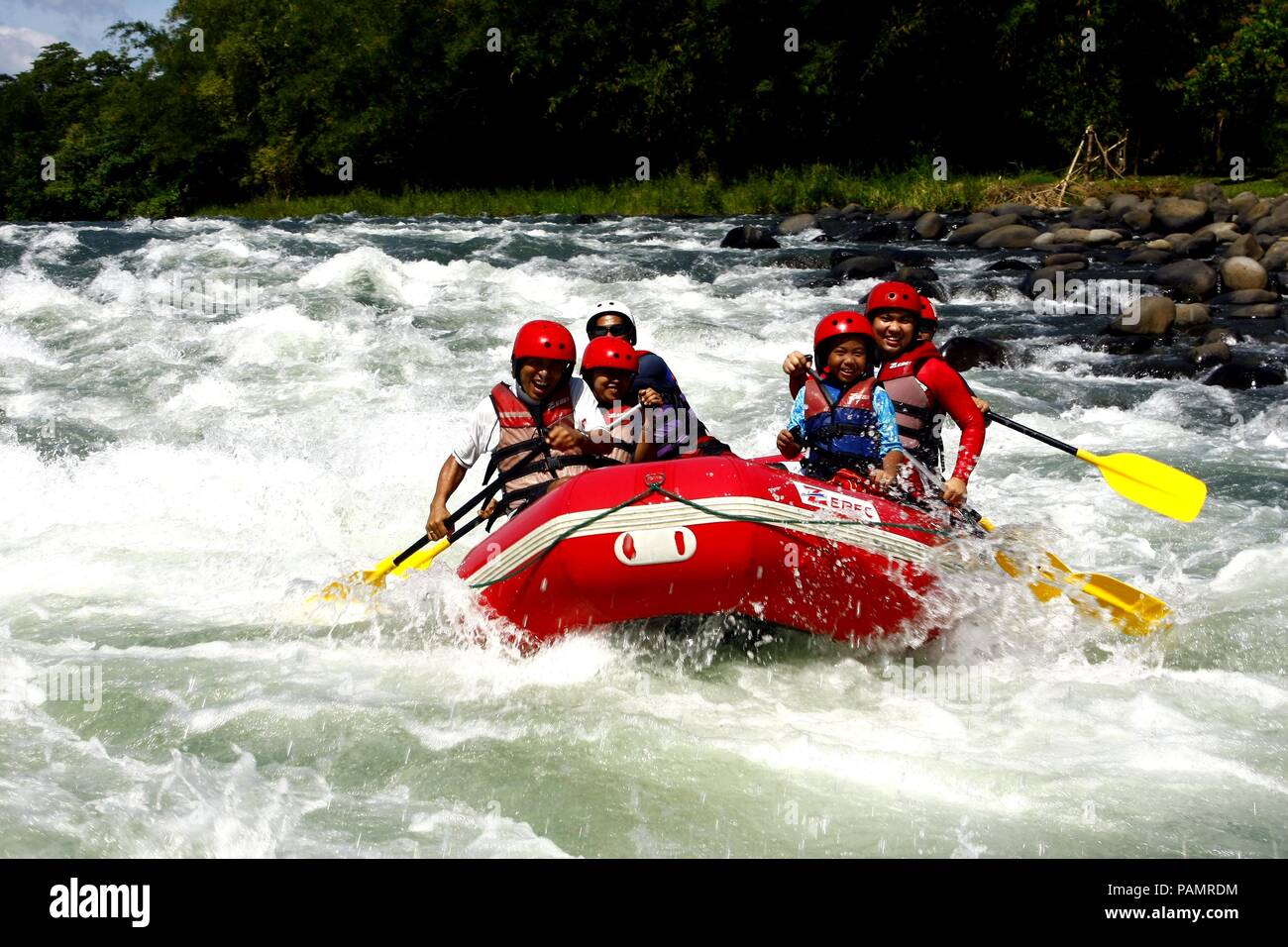 CAGAYAN DE ORO, MINDANAO, PHILIPPINES - JUNE 5, 2009: Tourists ride on ...