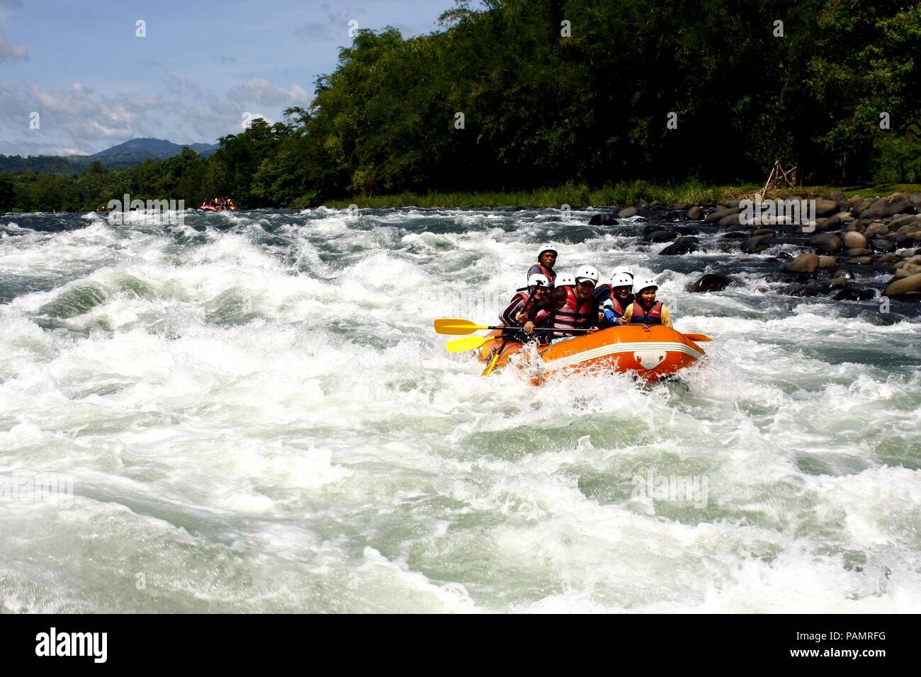 CAGAYAN DE ORO, MINDANAO, PHILIPPINES - JUNE 5, 2009: Tourists ride on ...