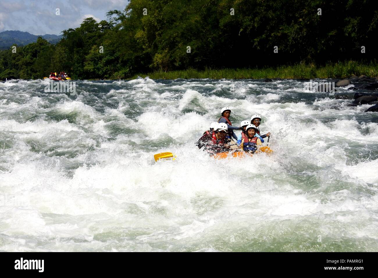 CAGAYAN DE ORO, MINDANAO, PHILIPPINES - JUNE 5, 2009: Tourists ride on ...