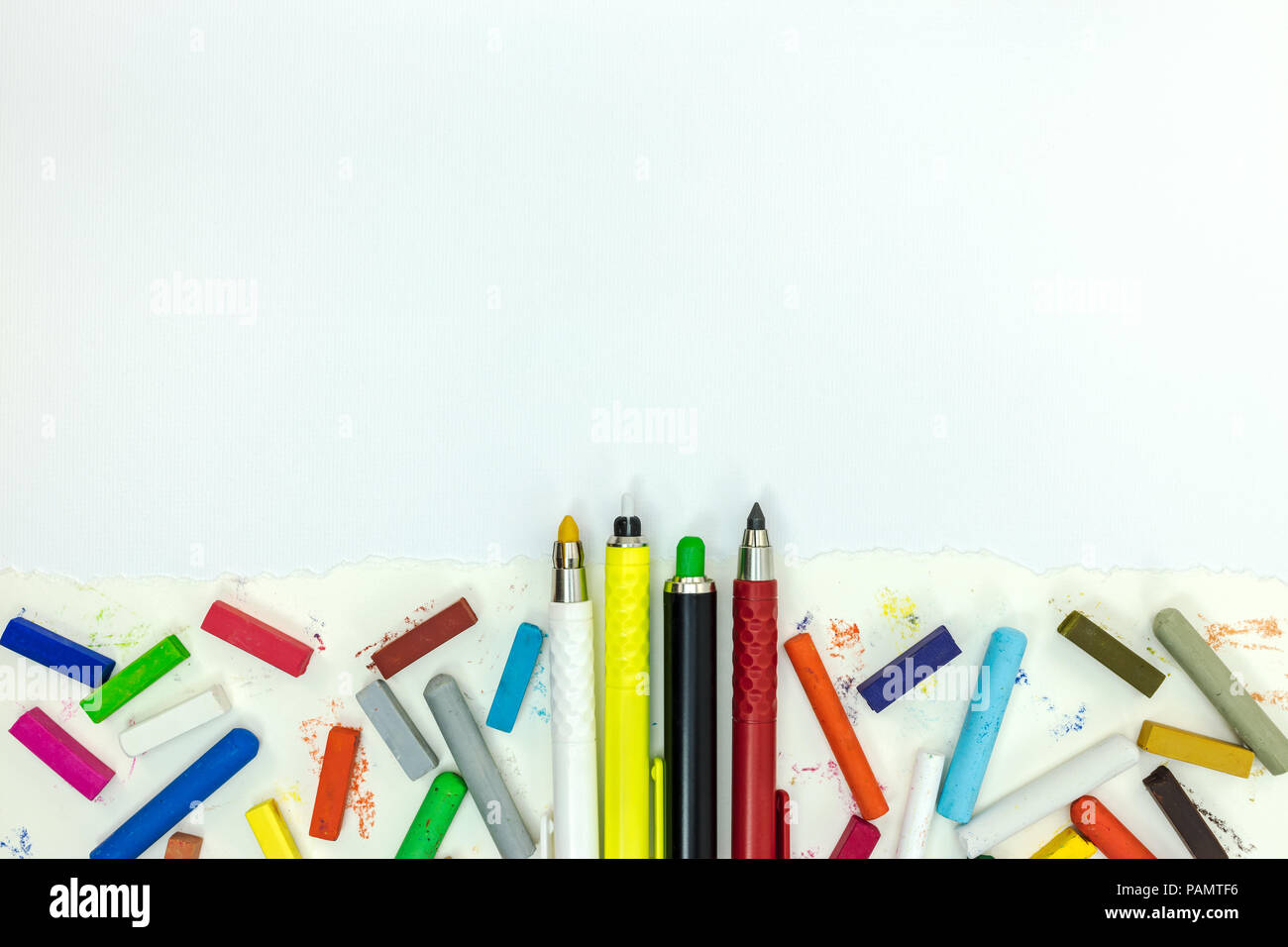 school painting tools on paper sheet. colored crayons and markers on ...
