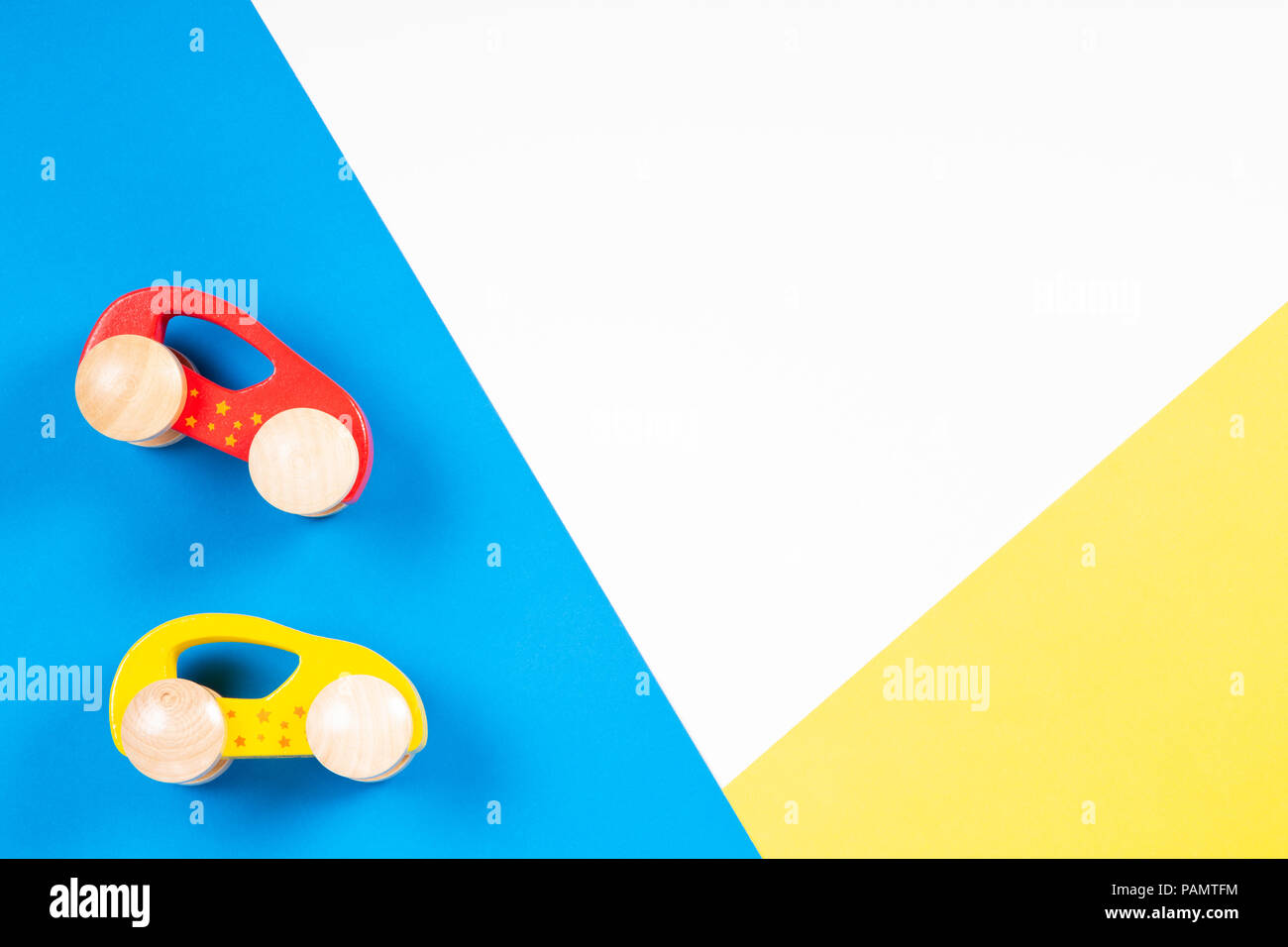 Two Wooden Toy Cars on Colorful Background Stock Photo - Alamy