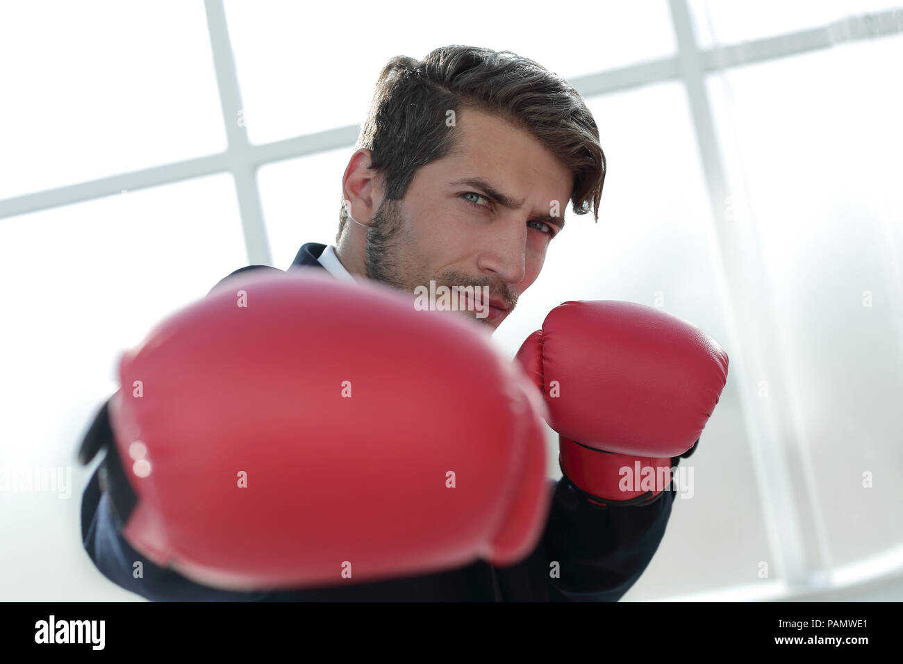 Businessman standing posture with boxing gloves Stock Photo - Alamy