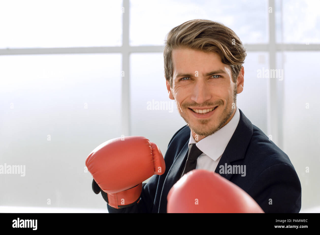 Businessman standing posture with boxing gloves Stock Photo - Alamy