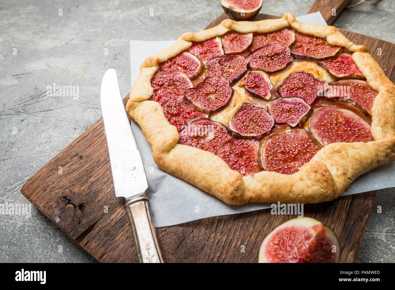Homemade figs galette made with fresh organic figs on stone background ...