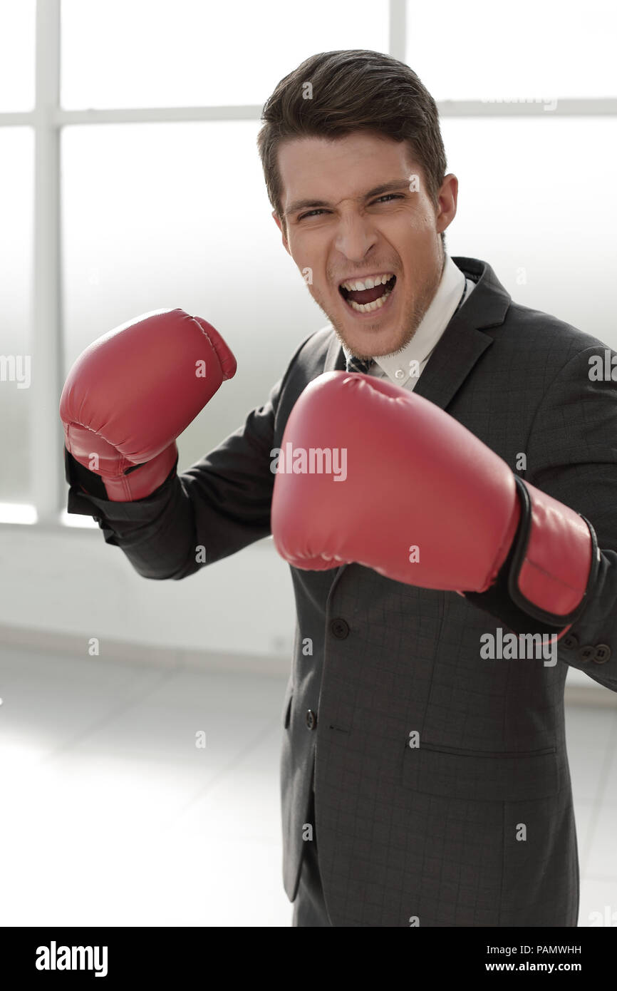 businessman in Boxing gloves, standing near the office window Stock ...