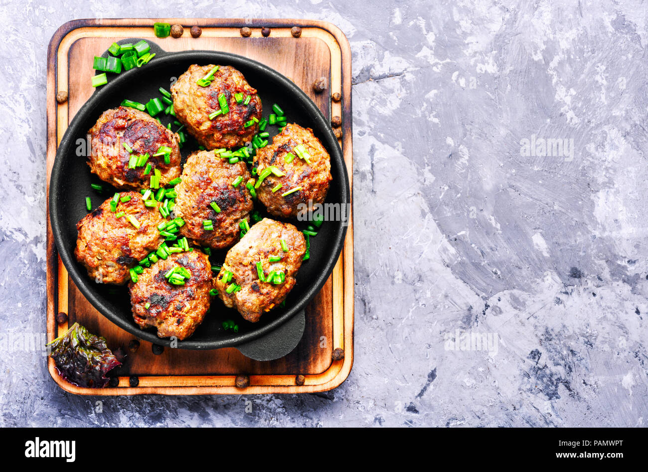 Roasted beef meatballs in cast-iron skillet.Delicious cutlet Stock ...