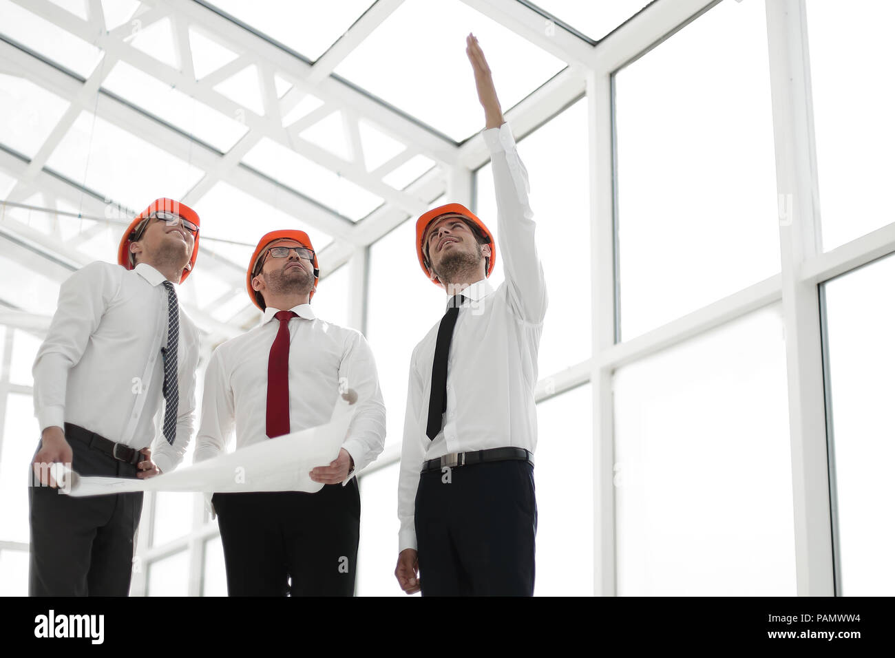 architect shows the customer a new building Stock Photo - Alamy