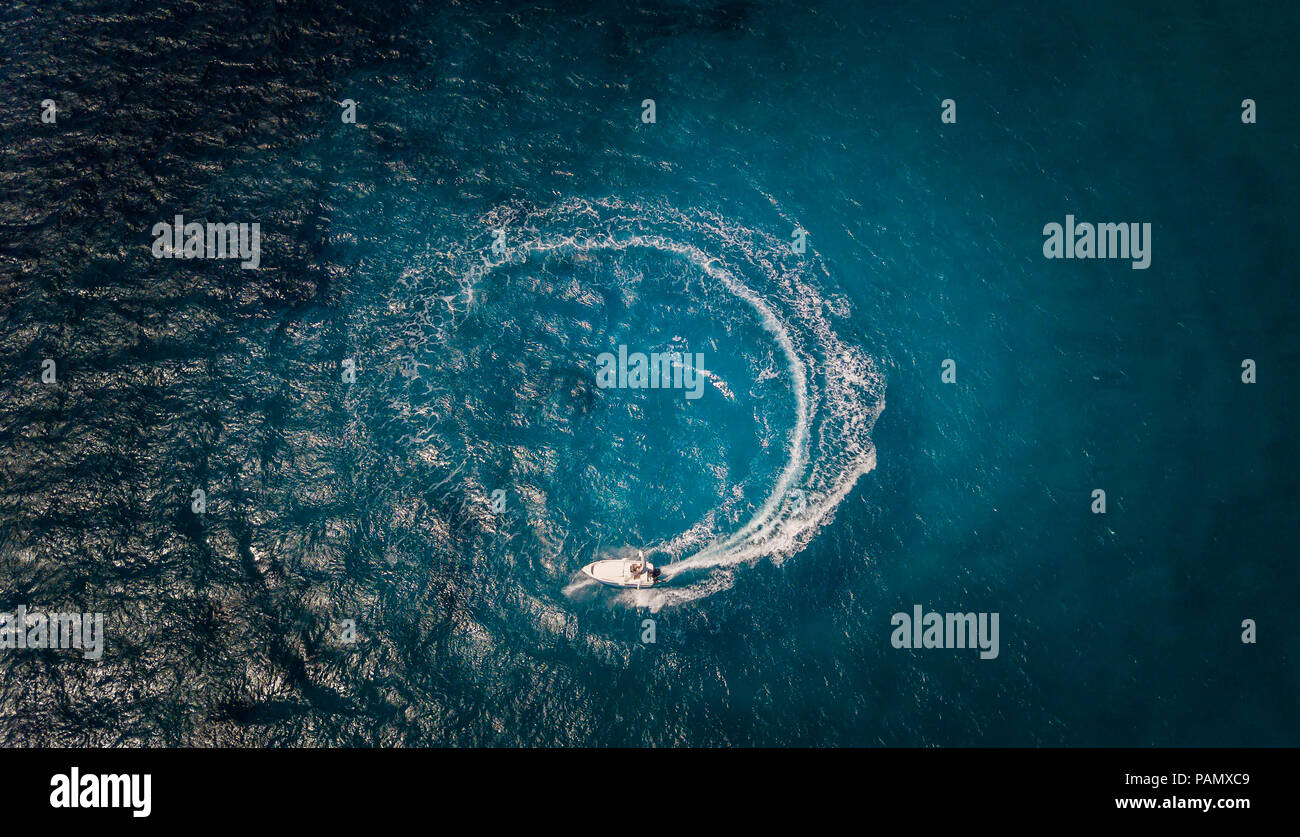 Aerial view of speed boat in circle motion. Water transportation and ...