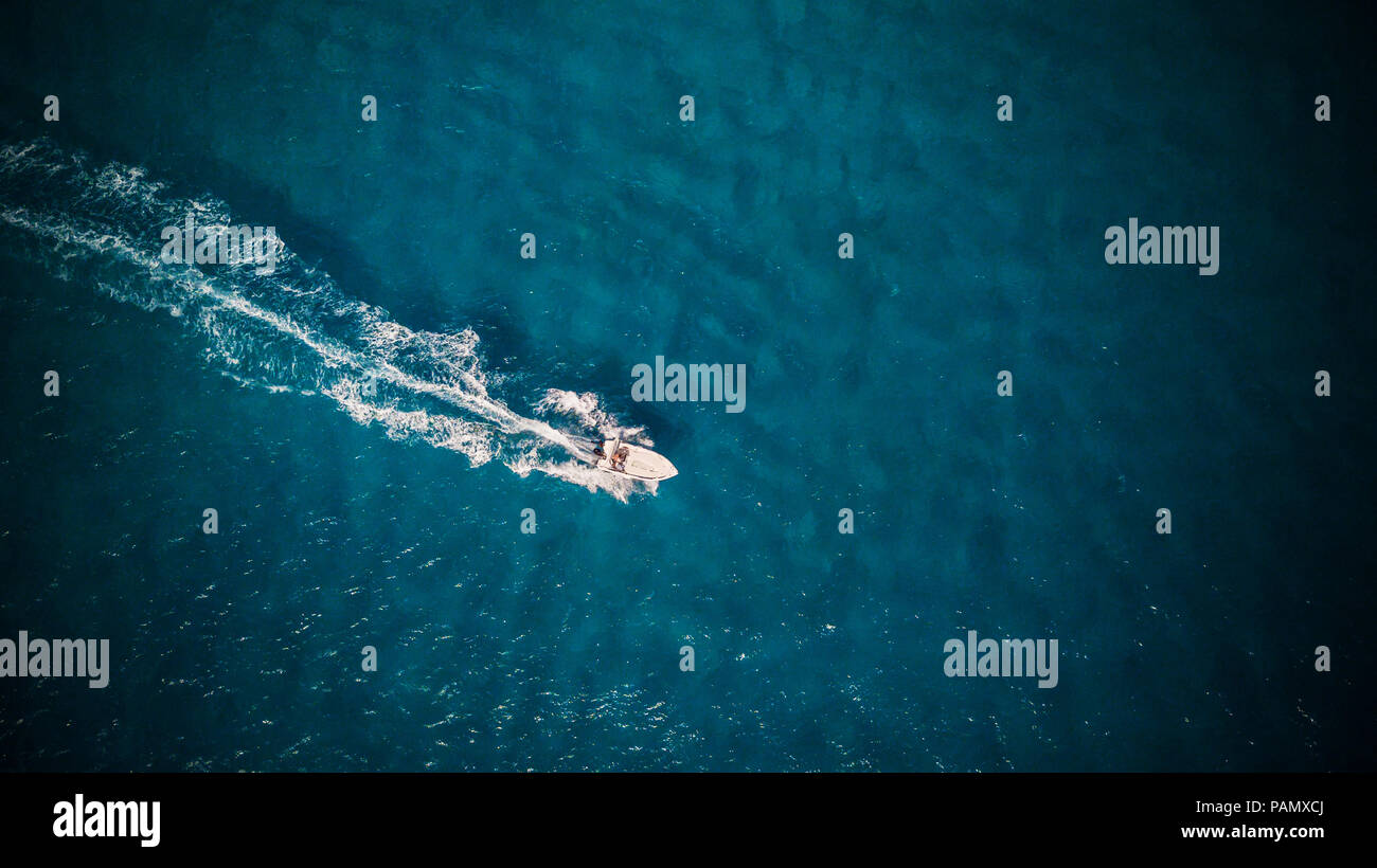 Aerial view of speed boat in motion. Water transportation and summer ...